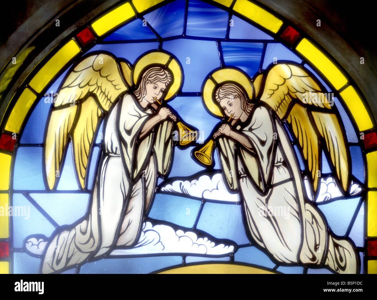 Two Angles with horns are depicted in this beautiful stained glass ...