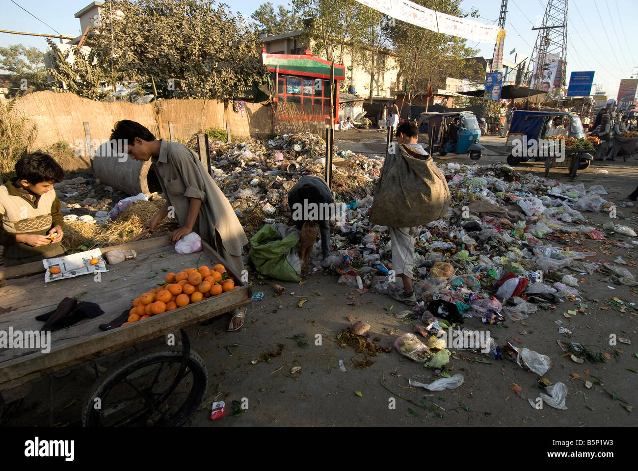 Children Scavenging Rubbish in Lahore Pakistan next to A Fruit Sellers ...
