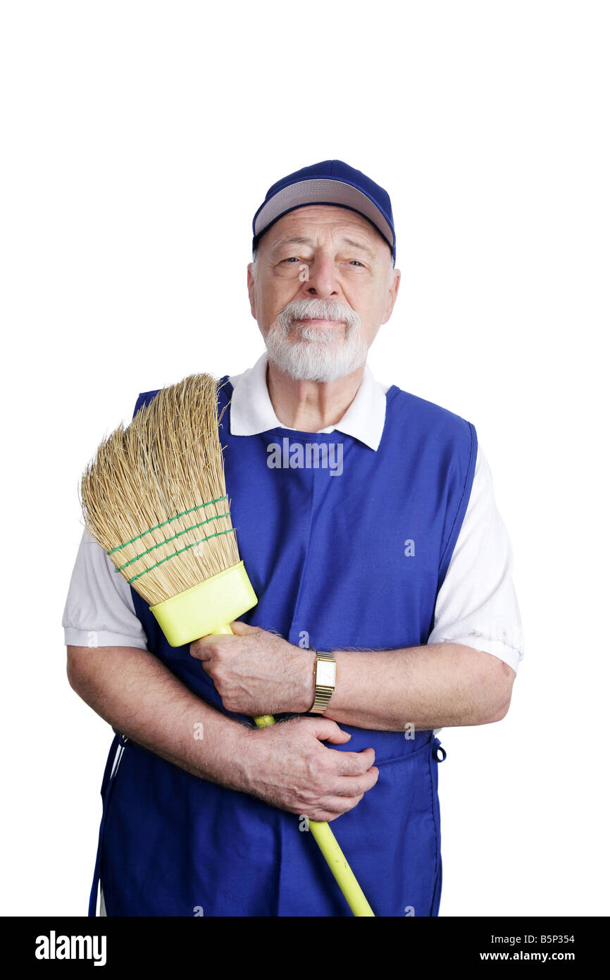 A senior man working at a discount store sweeping up Isolated on white ...