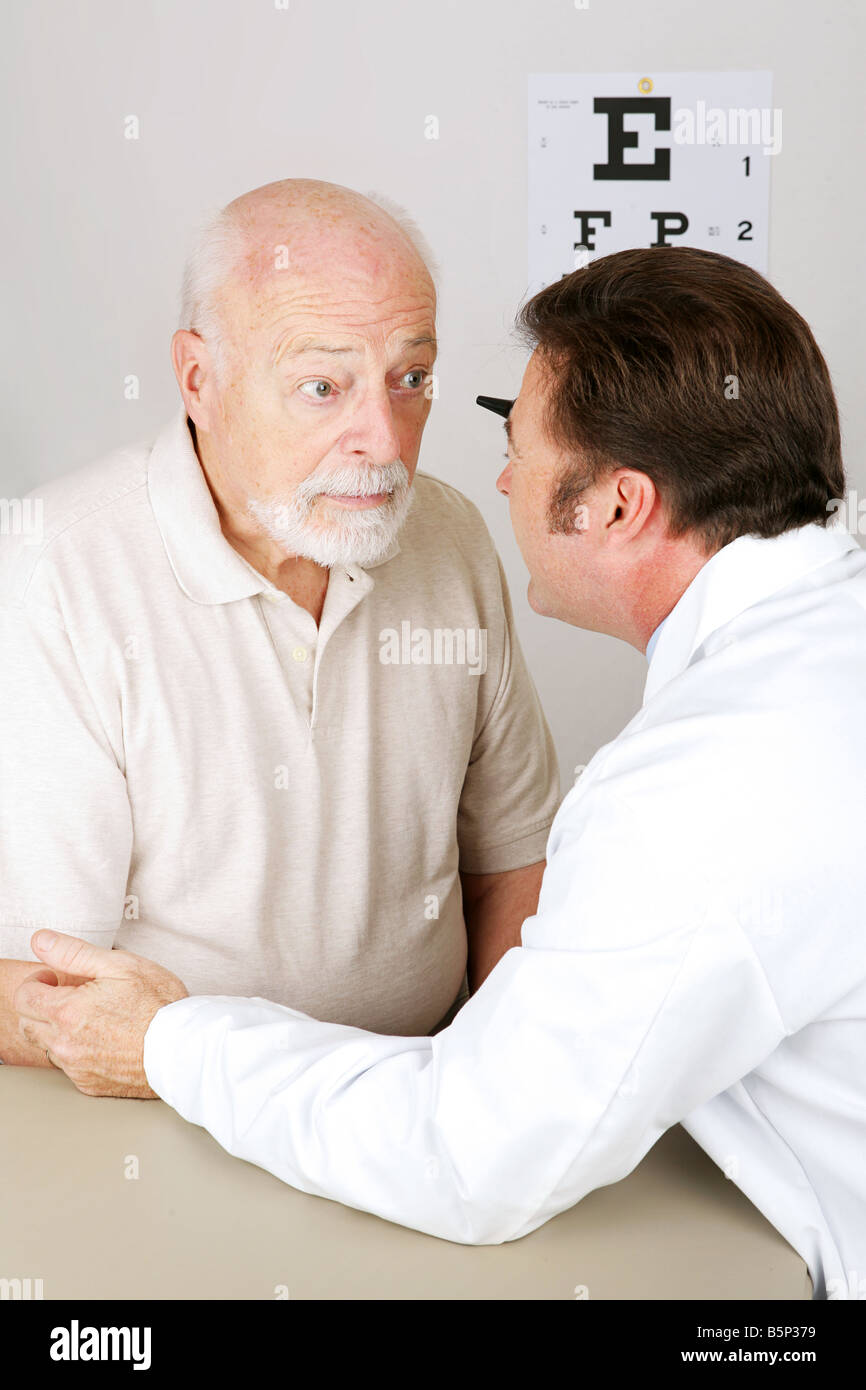 Vertical view of an optician examining a patient s eyes with an ophthalmoscope Stock Photo - Alamy