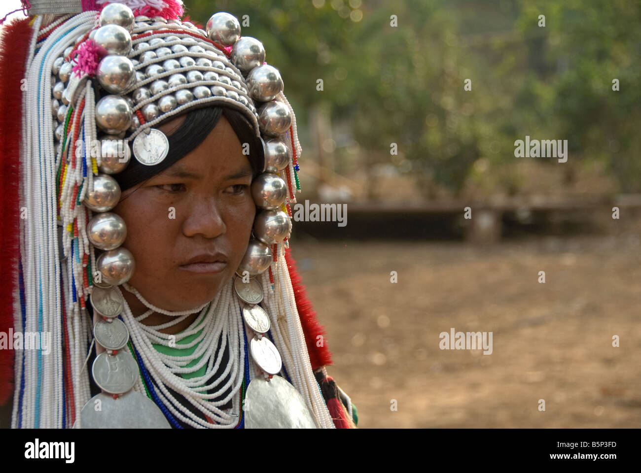 Akha hill tribe woman wearing her traditional clothing Stock Photo - Alamy
