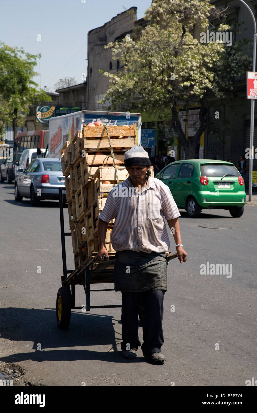 Man hauling fruit to market, Santiago, Chile Stock Photo - Alamy