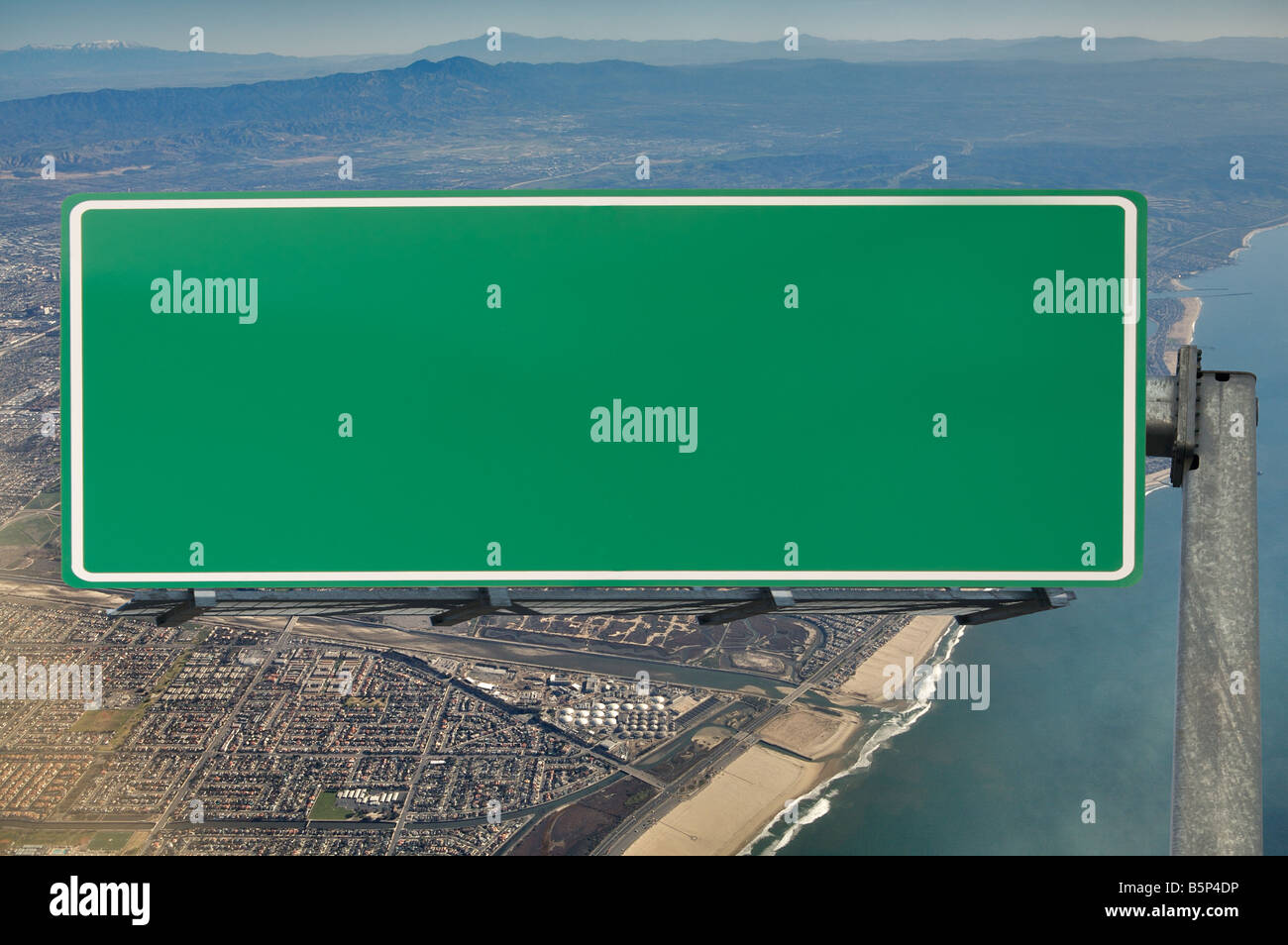 A large green traffic sign with wall street on it Stock Photo - Alamy