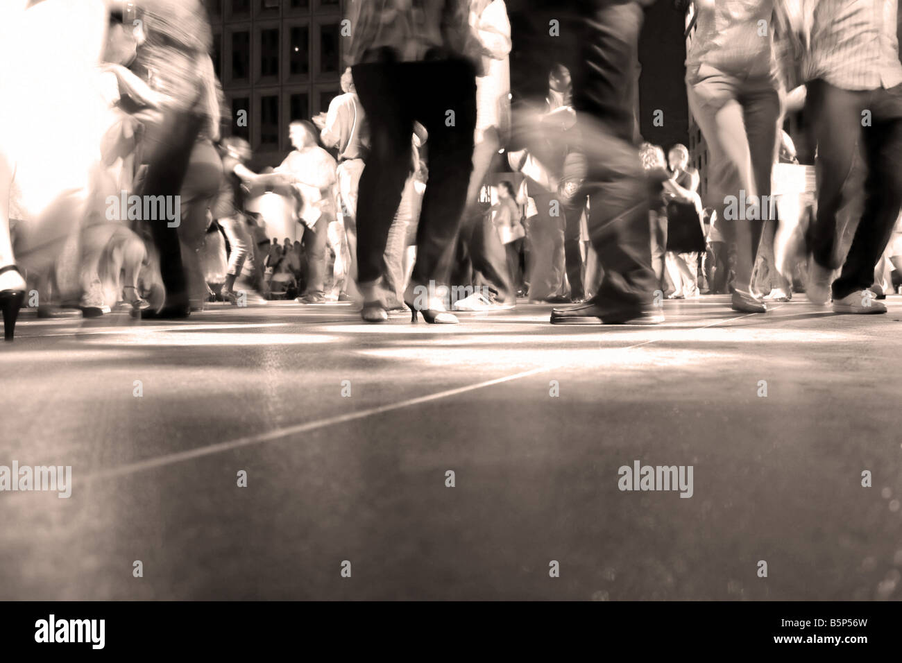 A low shot of the dance floor with people dancing under the colorful ...