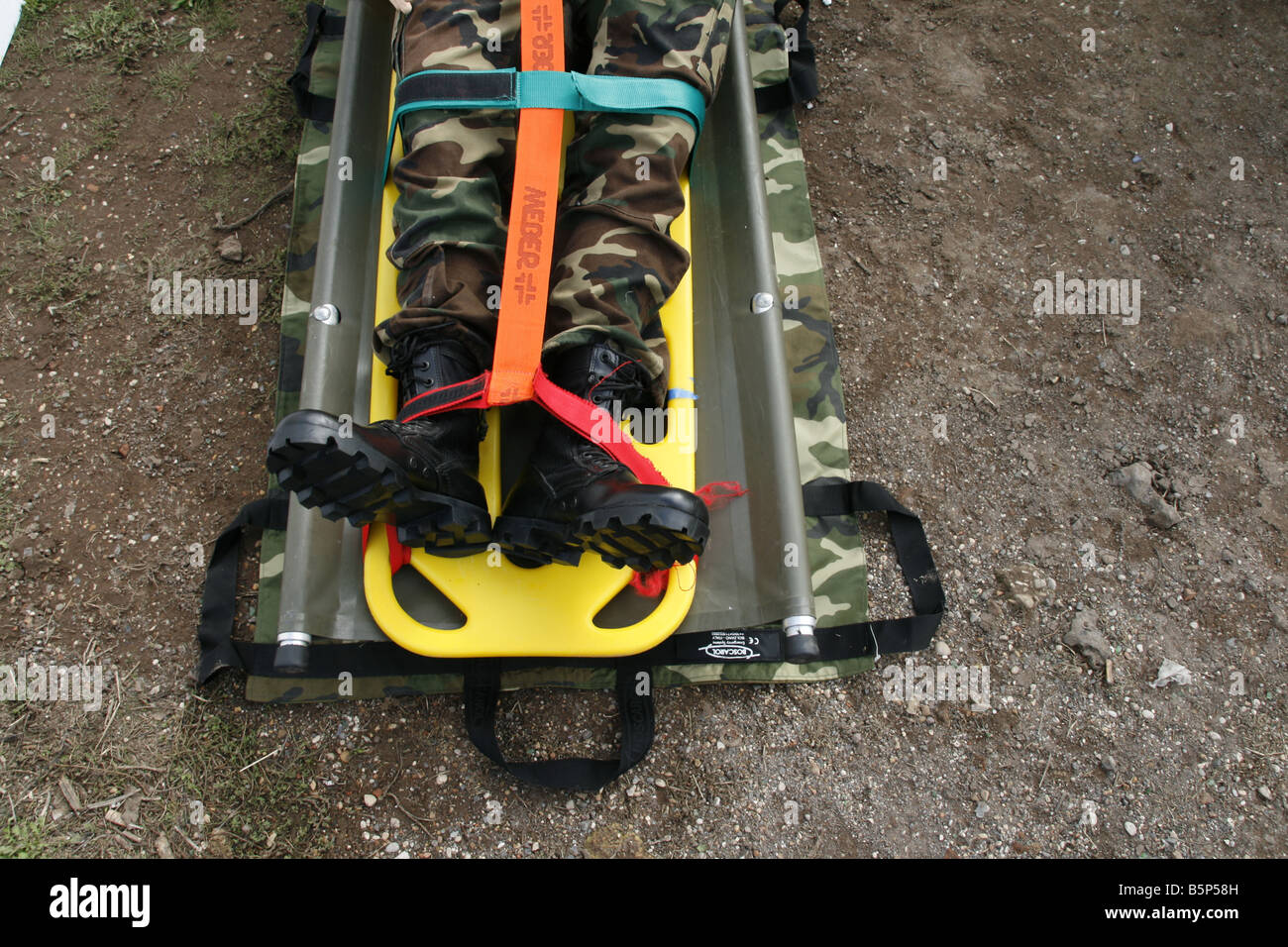 mock up wounded injury soldier mannequin on stretcher at military open ...