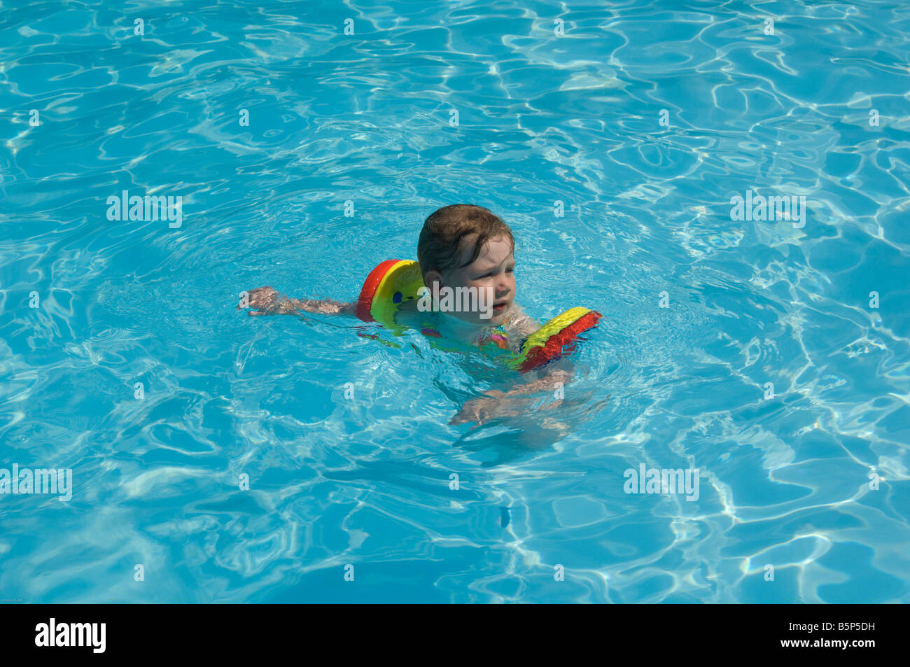 Swimming with floats hi-res stock photography and images - Alamy