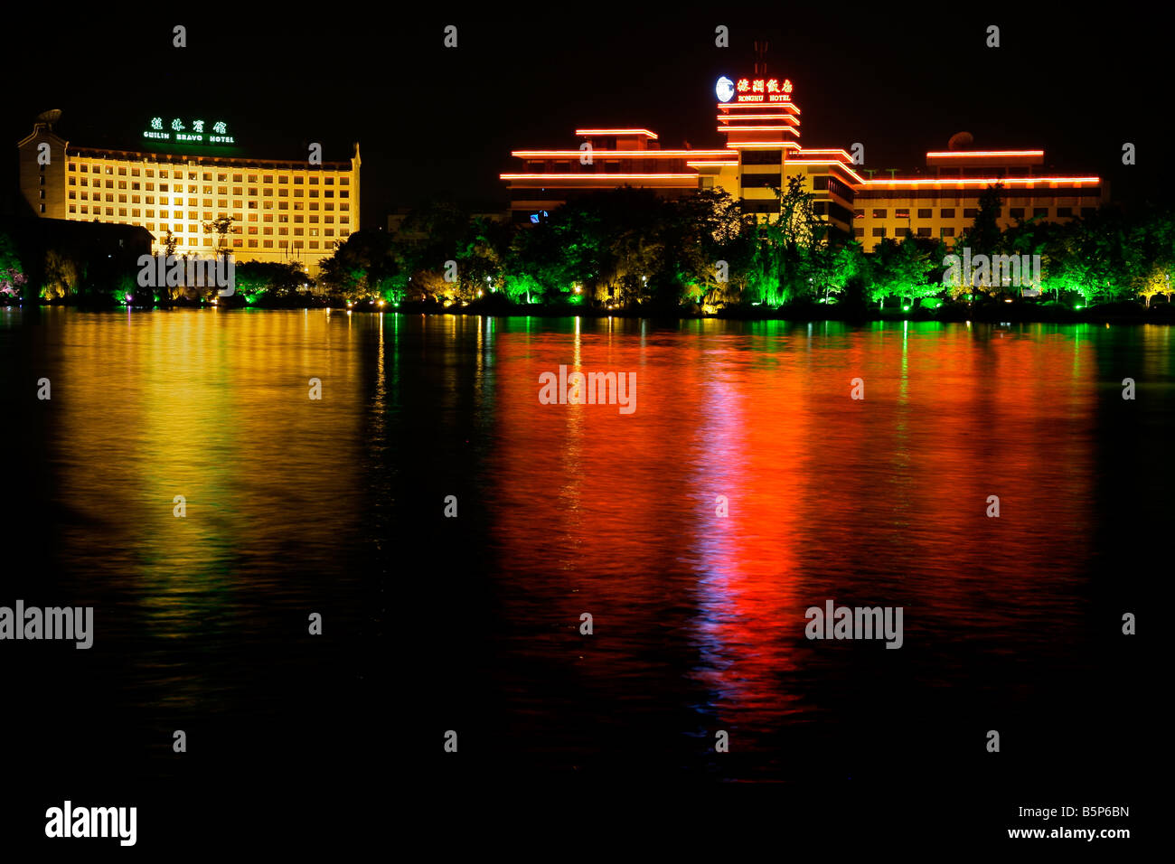 Colorful night scene of Guilin city at night with reflections in river ...