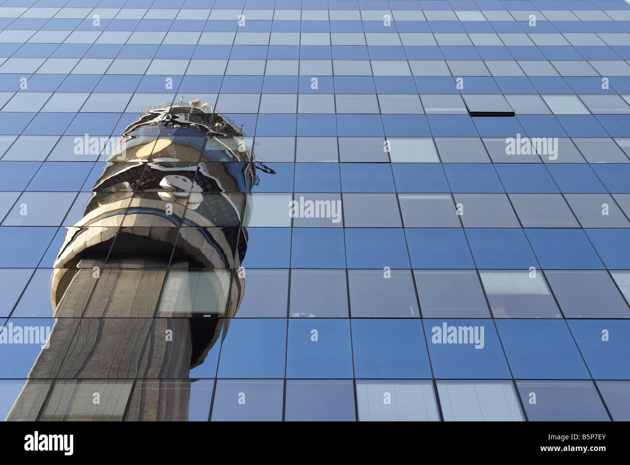 The Entel telecommunications tower reflected in the windows of a ...