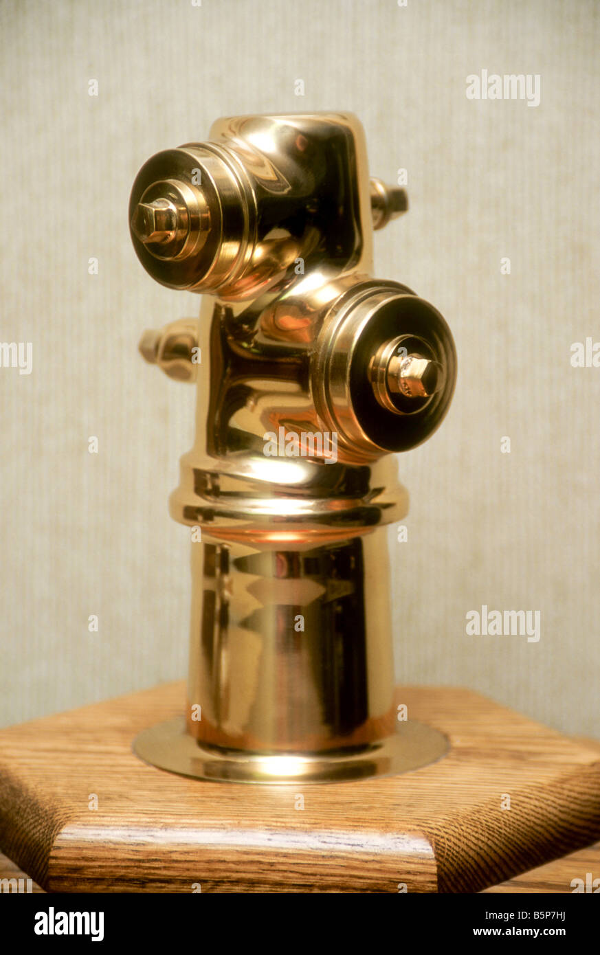 Trophy of miniature golden fireplug Stock Photo - Alamy