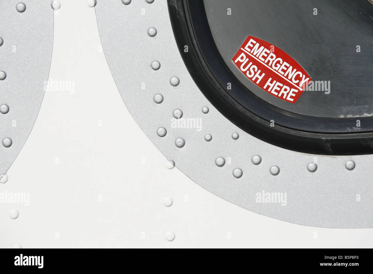 emergency exit push sign notice on helicopter window Stock Photo - Alamy