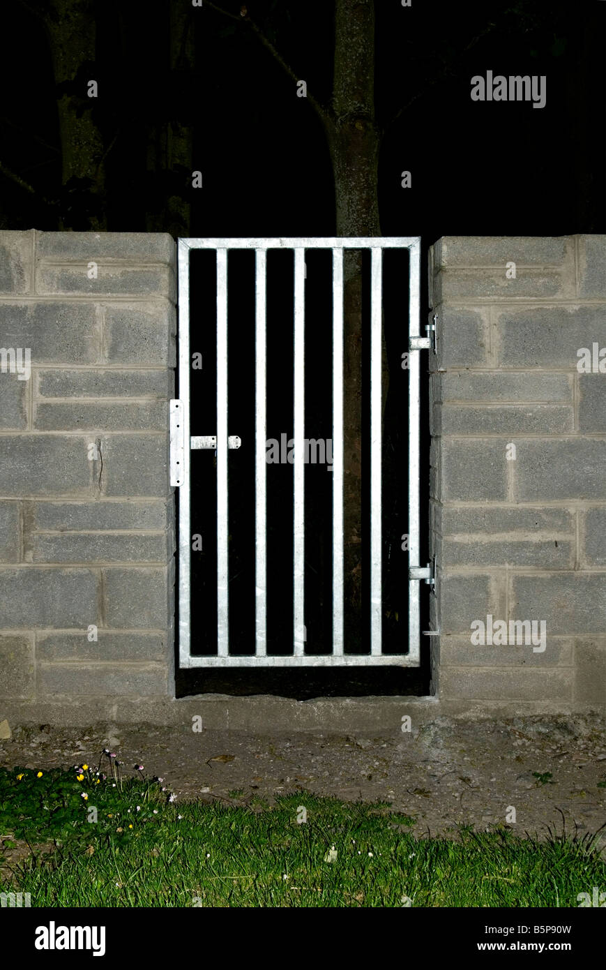 A barred gate in a wall Stock Photo - Alamy