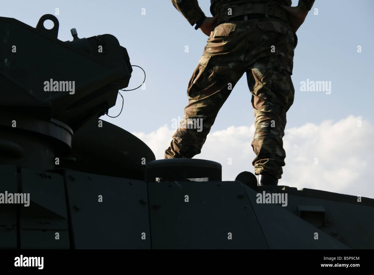 one soldier standing on armoured tank at open day Stock Photo - Alamy