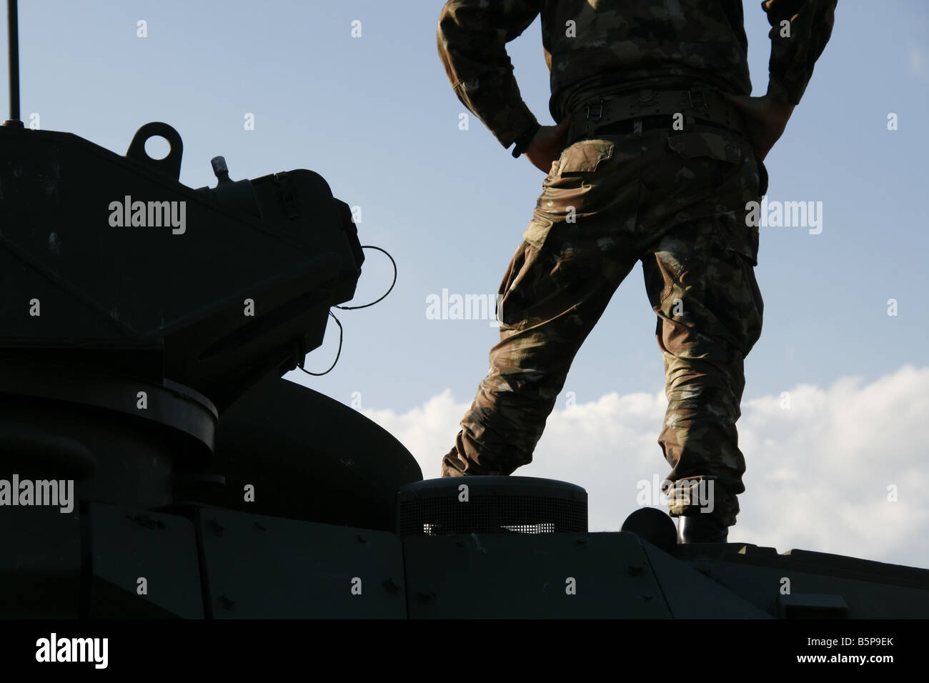 one soldier standing on armoured tank at open day Stock Photo - Alamy