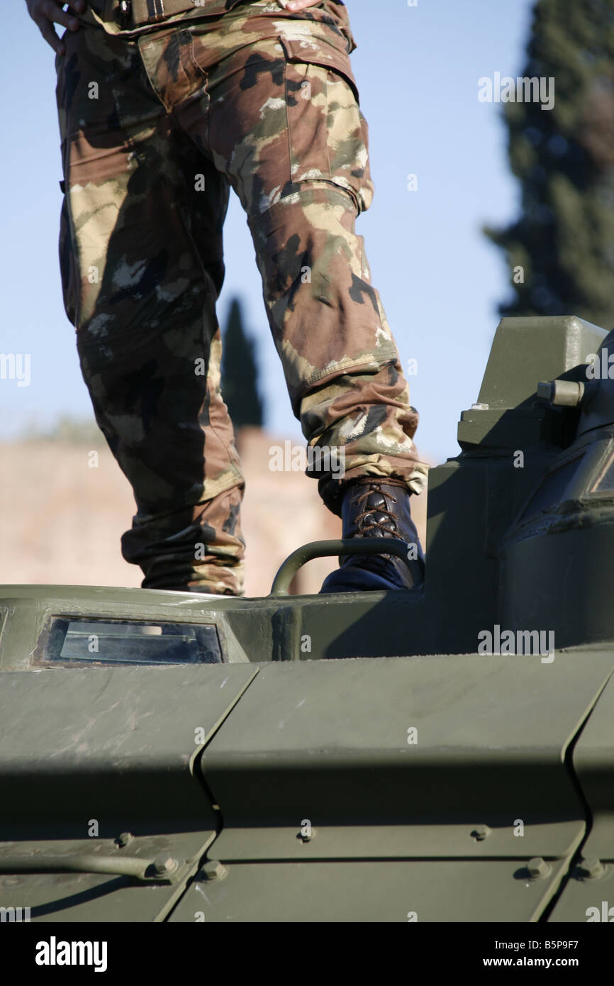 one soldier standing on armoured tank at open day Stock Photo - Alamy