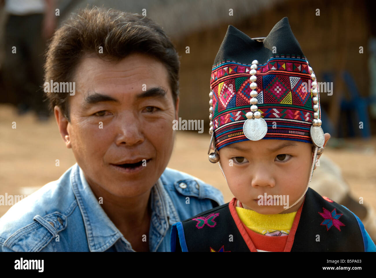 Akha father with his young son Stock Photo - Alamy