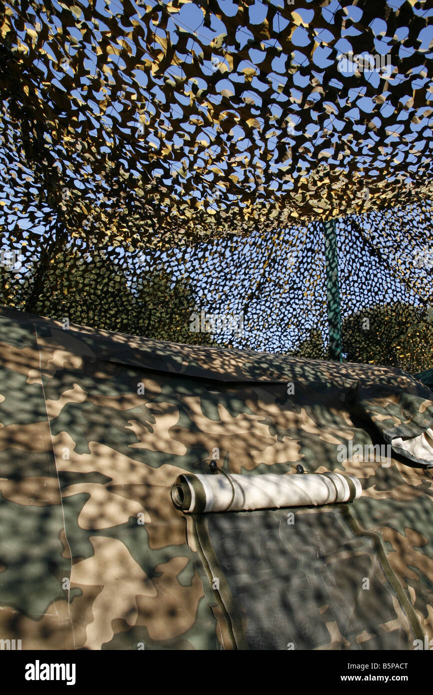 camouflage military army base tent at open day Stock Photo - Alamy