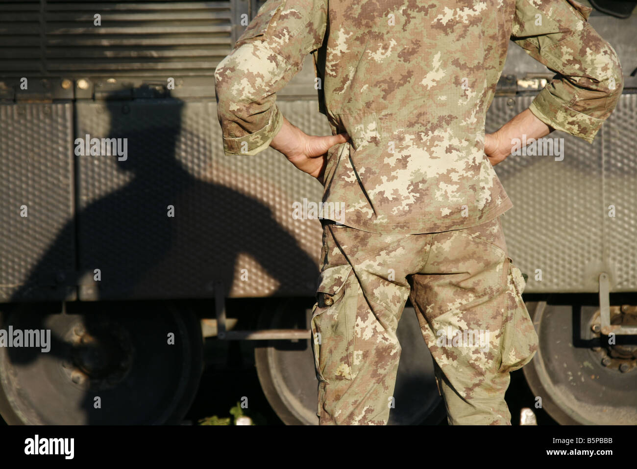 one soldier standing by armoured tank at open day Stock Photo - Alamy