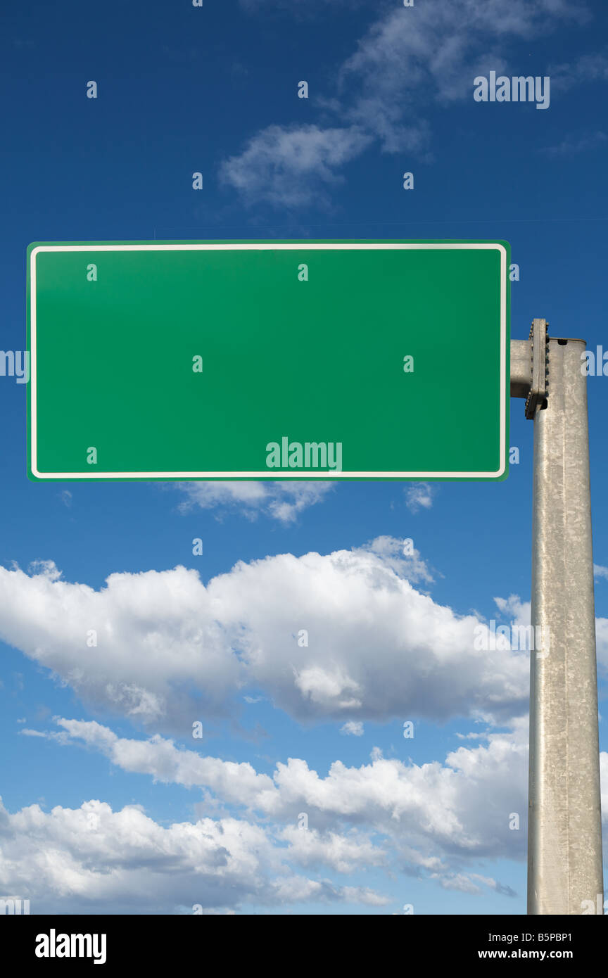 A large blank green traffic sign Stock Photo - Alamy