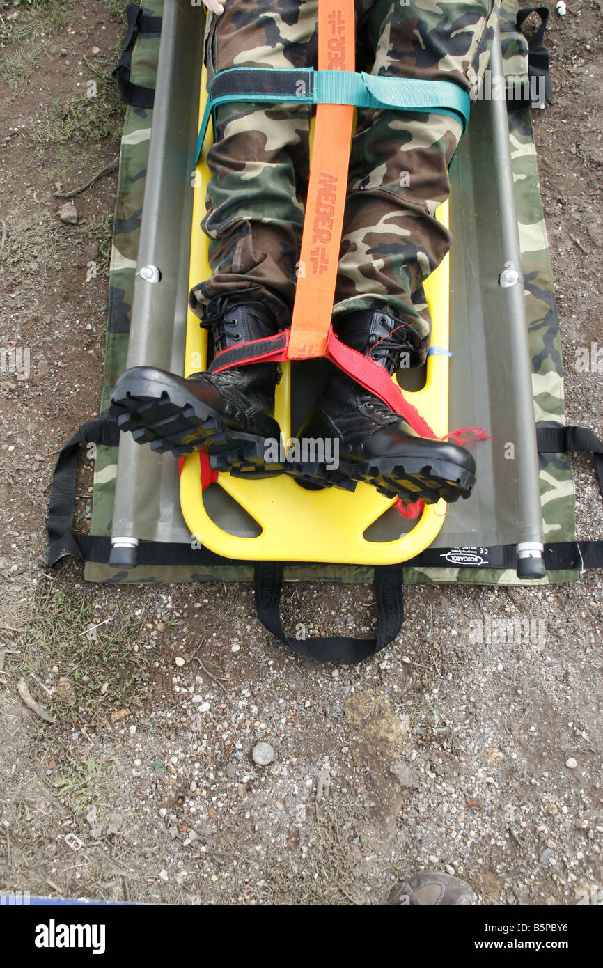 mock up wounded injury soldier mannequin on stretcher at military open ...