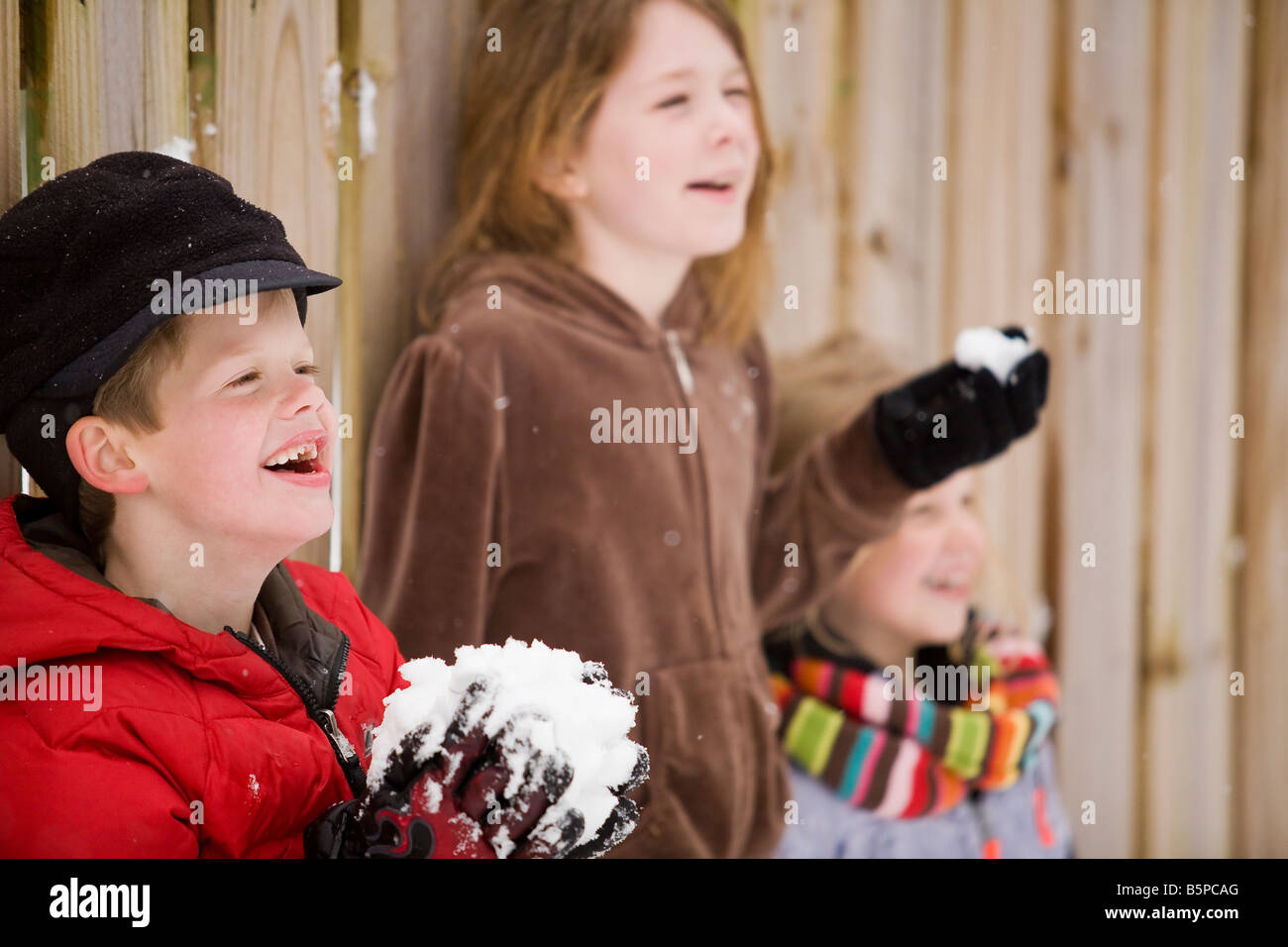 Standing against a wooden fence hi-res stock photography and images - Alamy