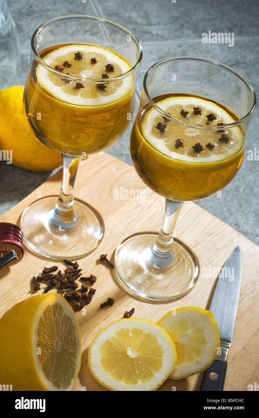 Hot whiskey with lemon and cloves is a popular remedy for colds and flu ...
