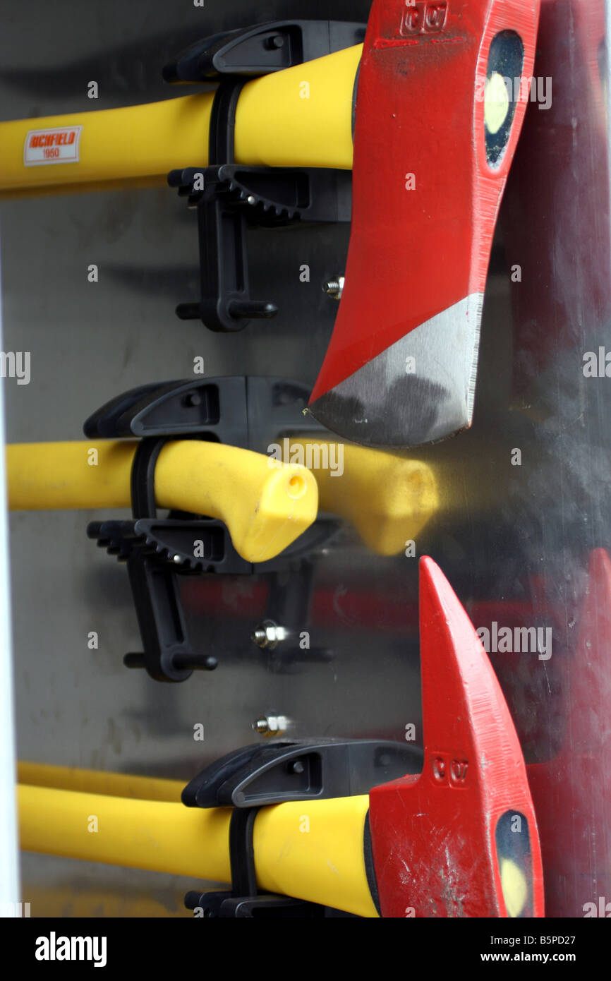Two axes stored in a fire truck compartment Stock Photo - Alamy