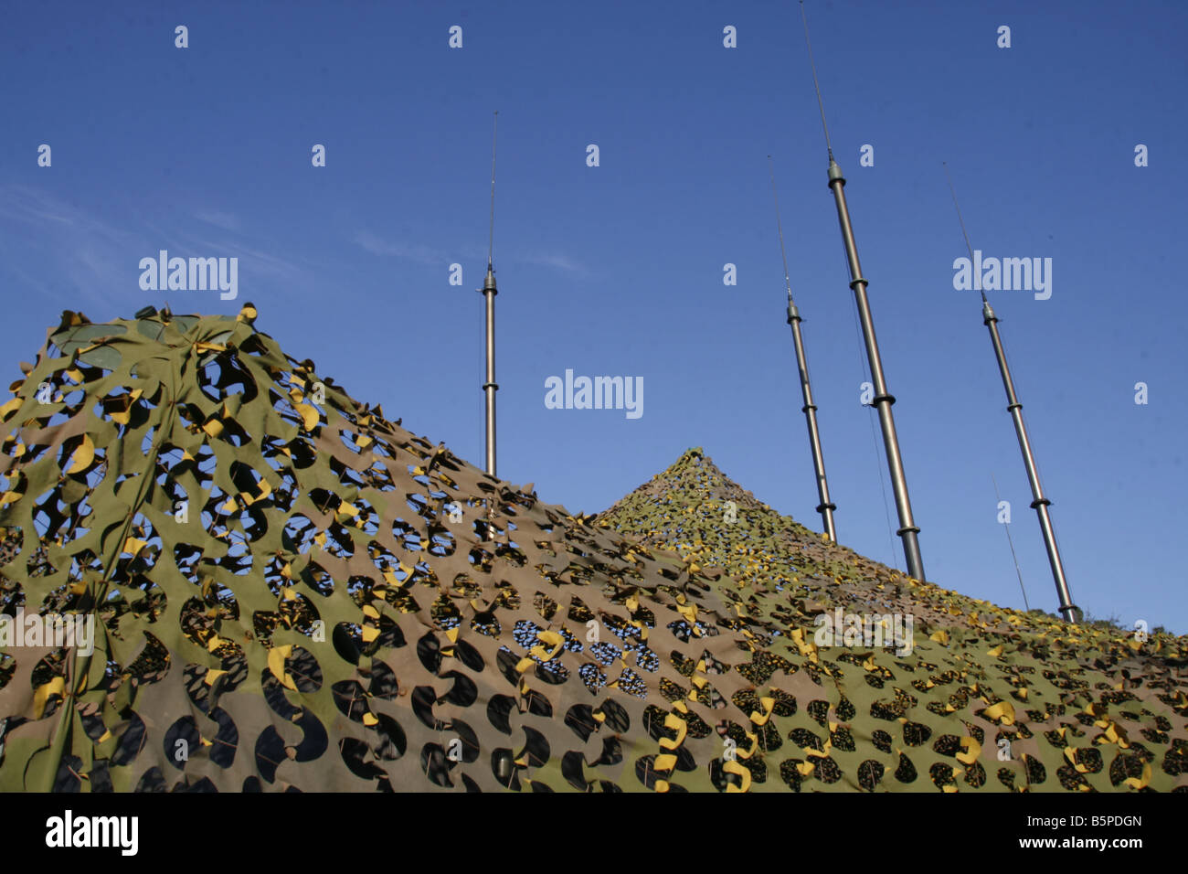 camouflage military army base tent at open day Stock Photo - Alamy