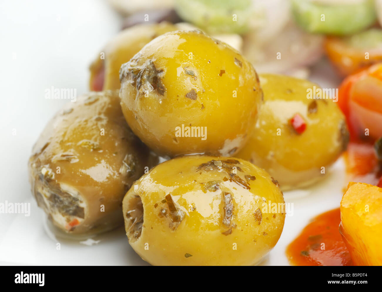 Stuffed Green Olives in olive oil Stock Photo - Alamy