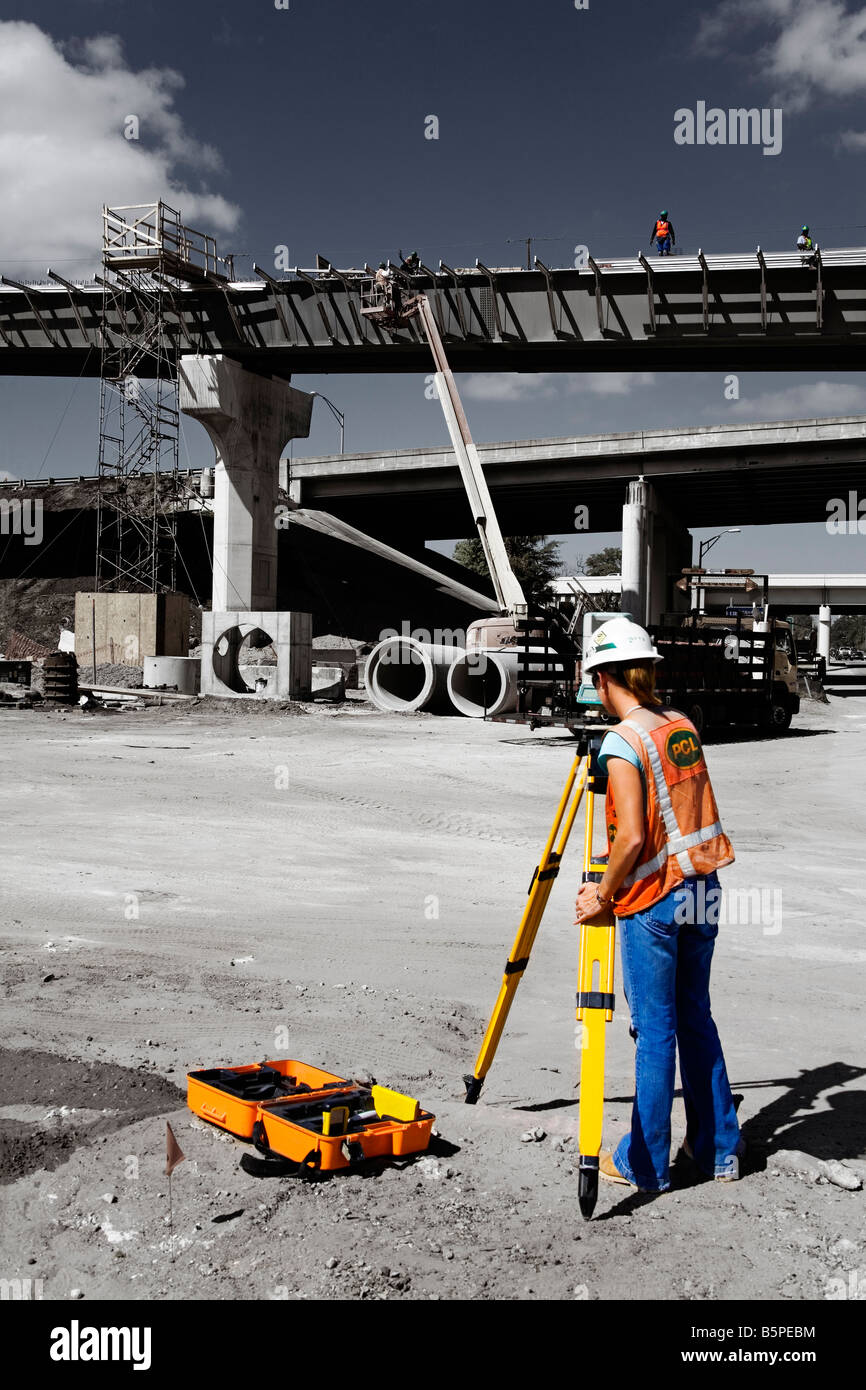 Female Surveyor working on Freeway 4 connector Downtown Orlando Florida ...
