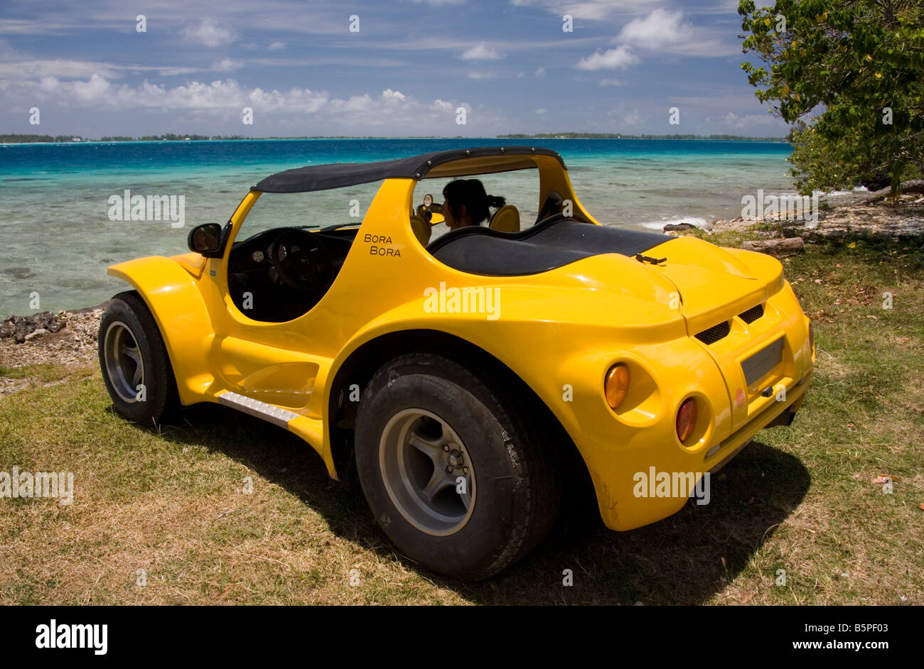 Yellow Bug by the water's edge in Bora Bora Stock Photo - Alamy