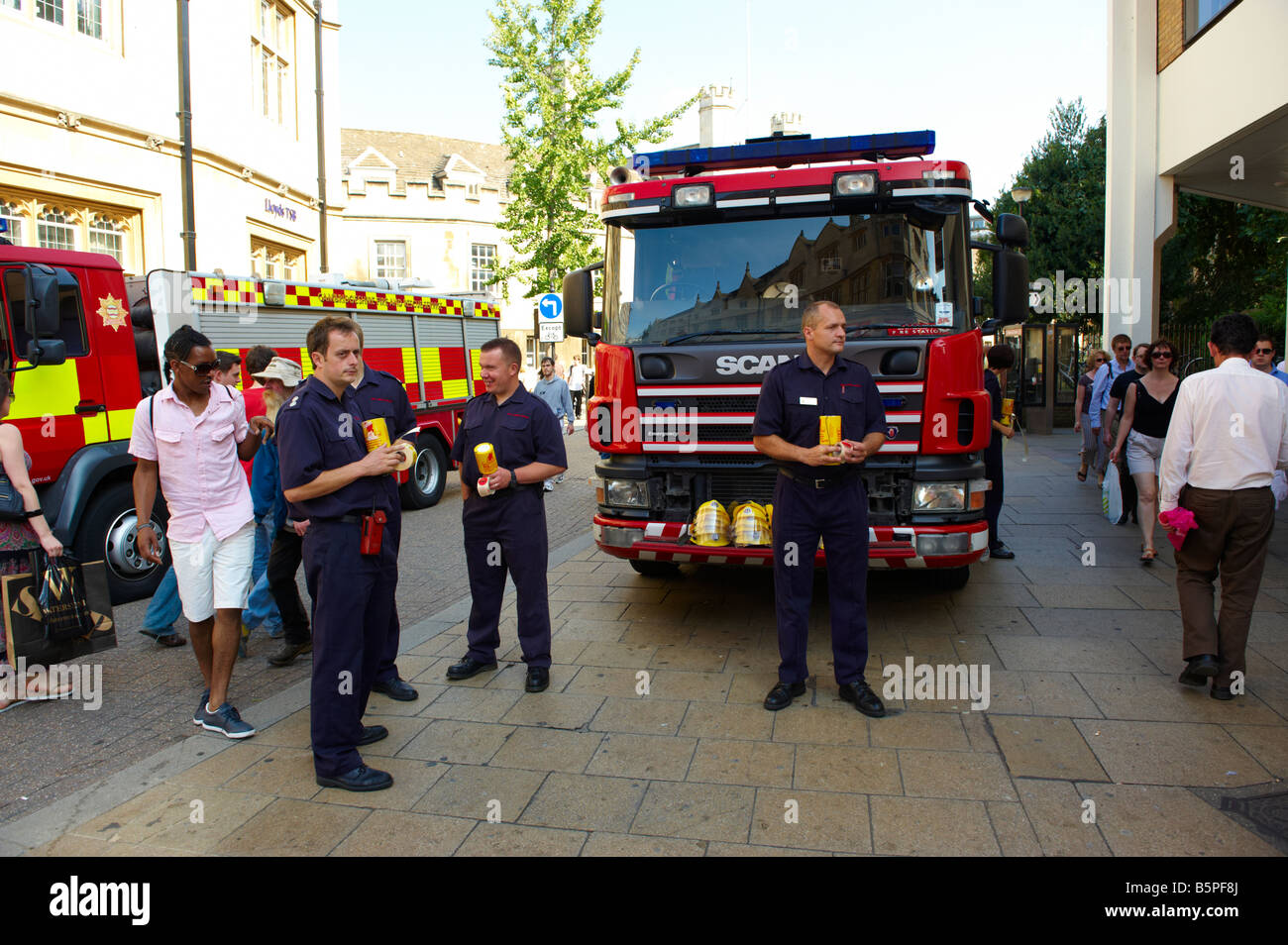 Fire Engine crew collecting for charity on display in Cambridge UK ...