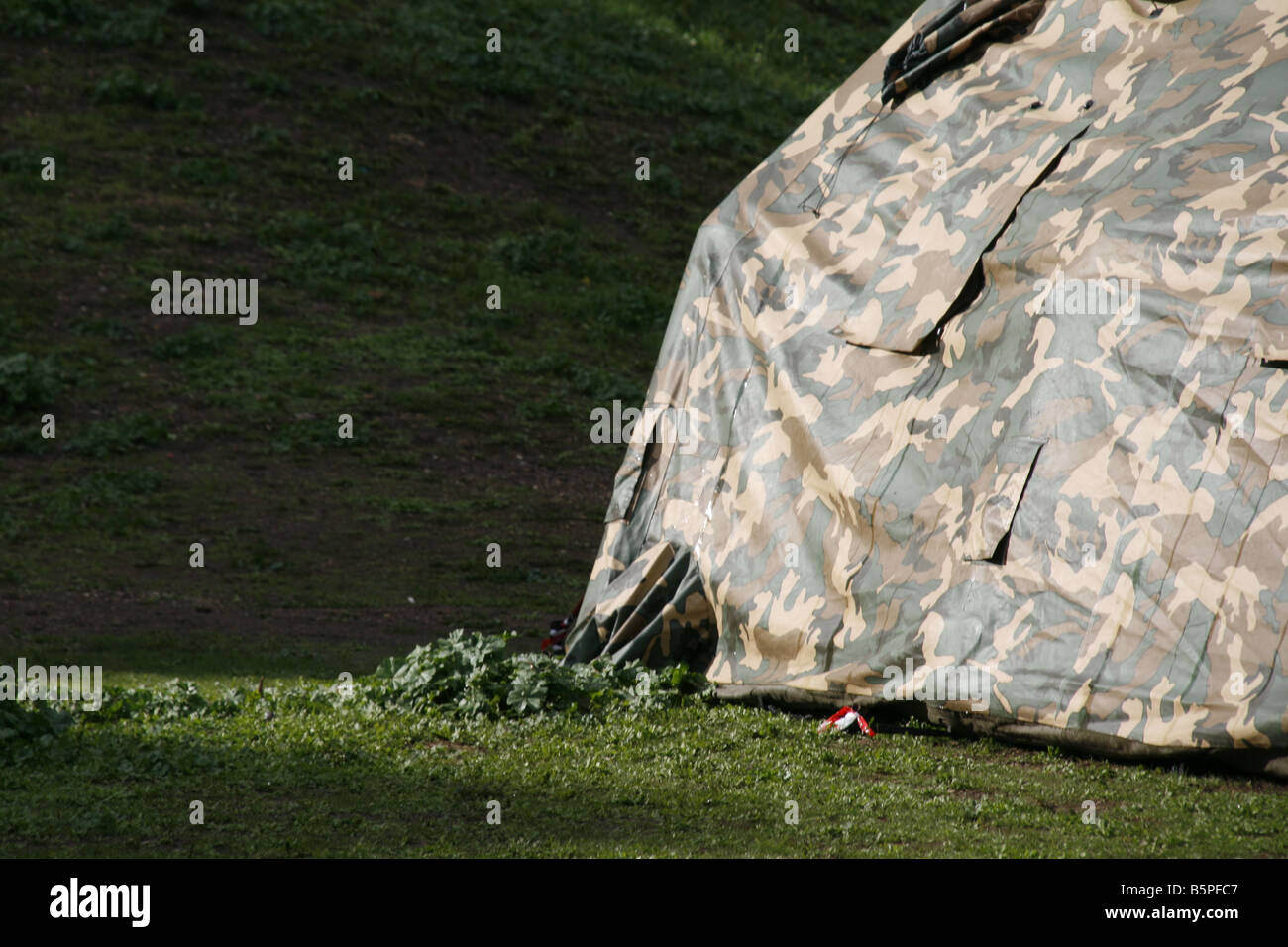 camouflage military army base tent at open day Stock Photo - Alamy