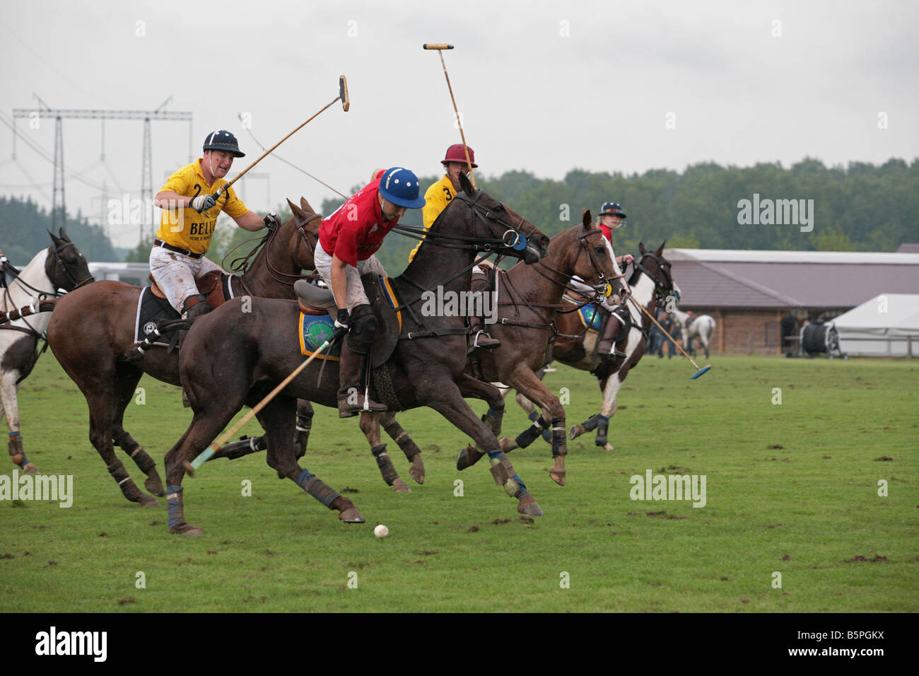 Polo players battle for position as they race down field Stock Photo ...
