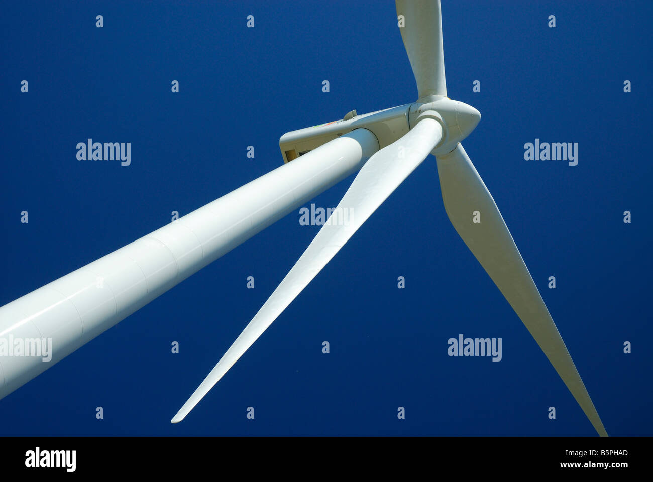 A close up to a wind turbine alternator on blue sky - France Stock ...