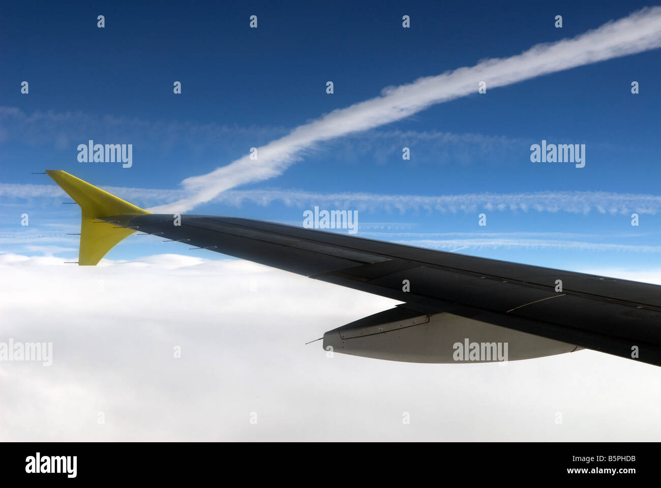 Wingtip of a Germanwings passenger airliner and vapor trails over the ...