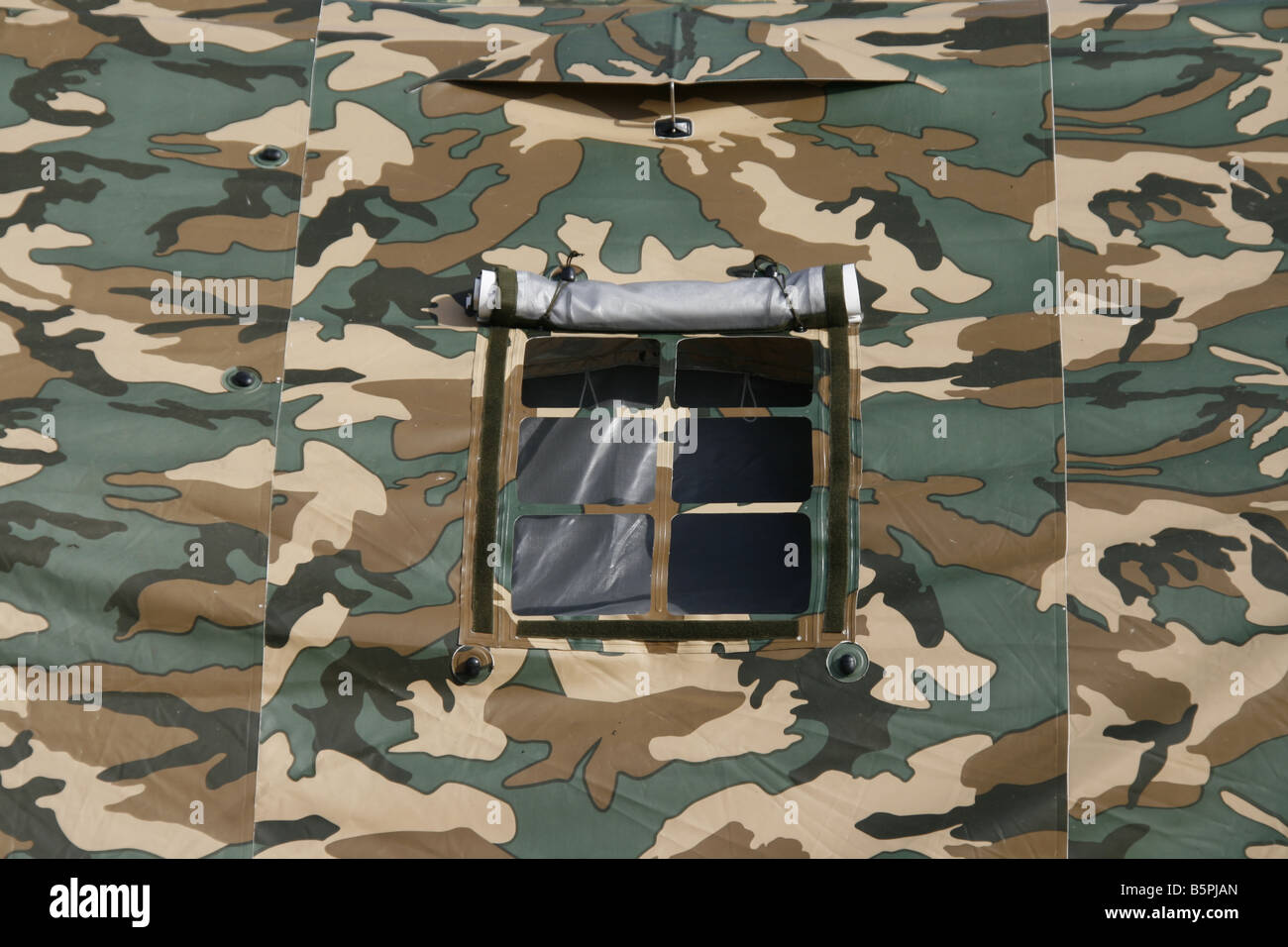 camouflage military army base tent at open day Stock Photo - Alamy