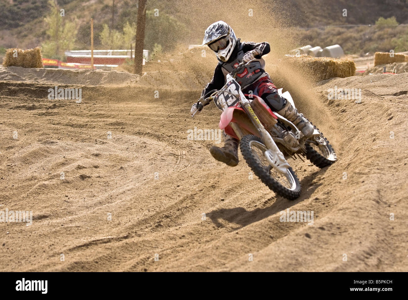 Motorcross rider sweeping through a bend at Glen Helen circuit Devore ...