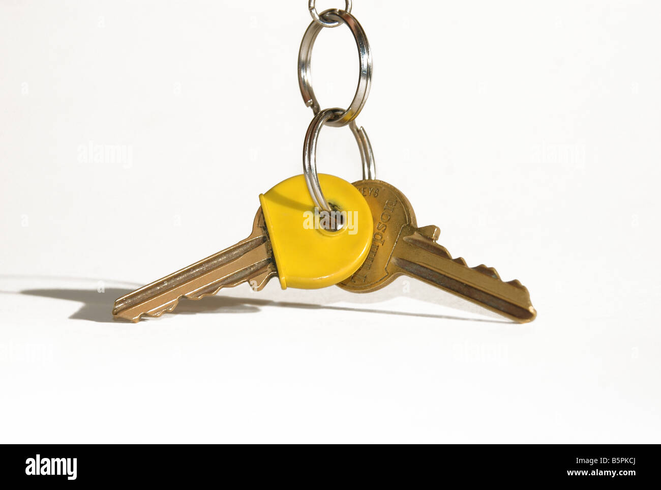 Two Yale keys attached to a key ring Stock Photo - Alamy