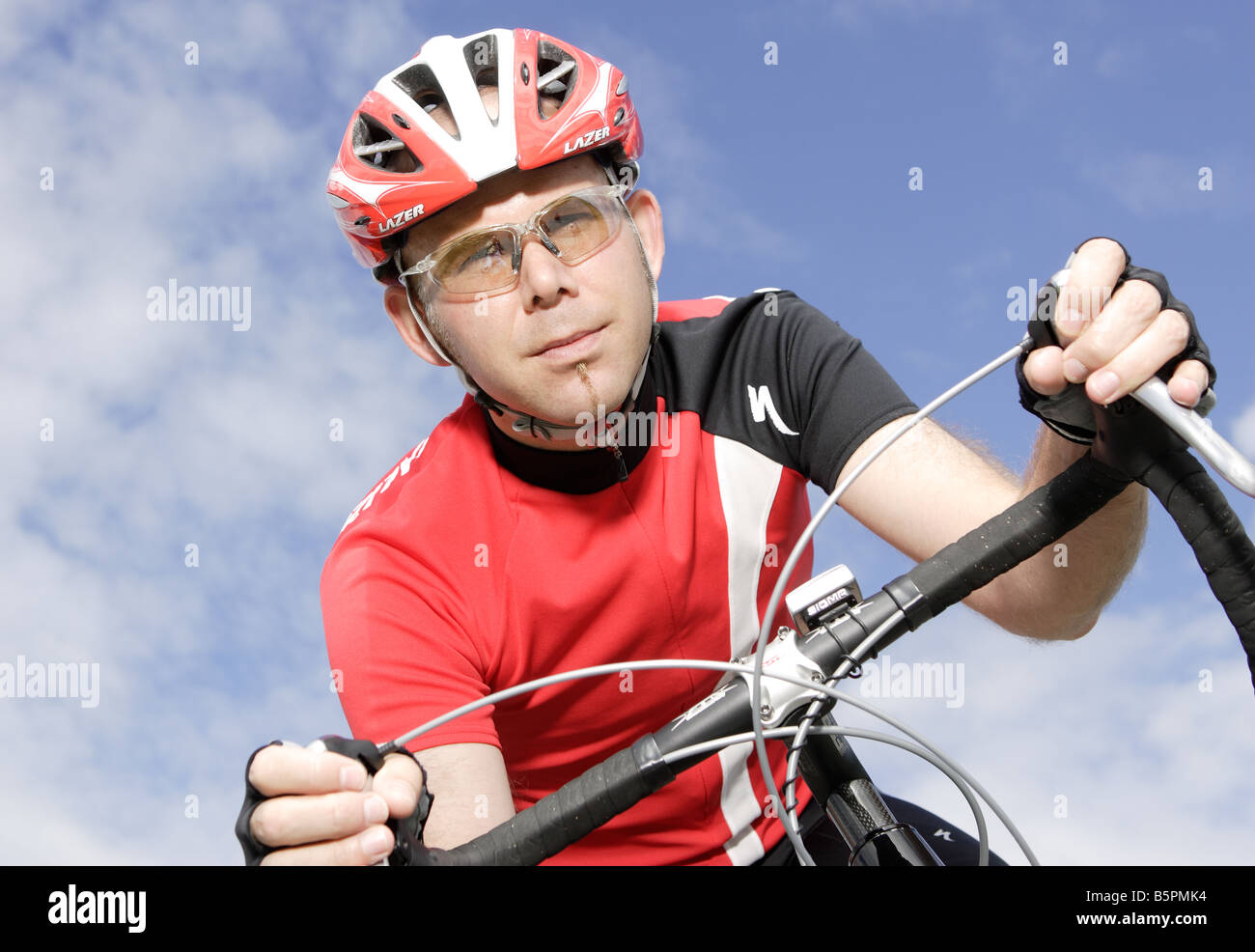 Racing cyclist wearing a safety helmet Stock Photo - Alamy