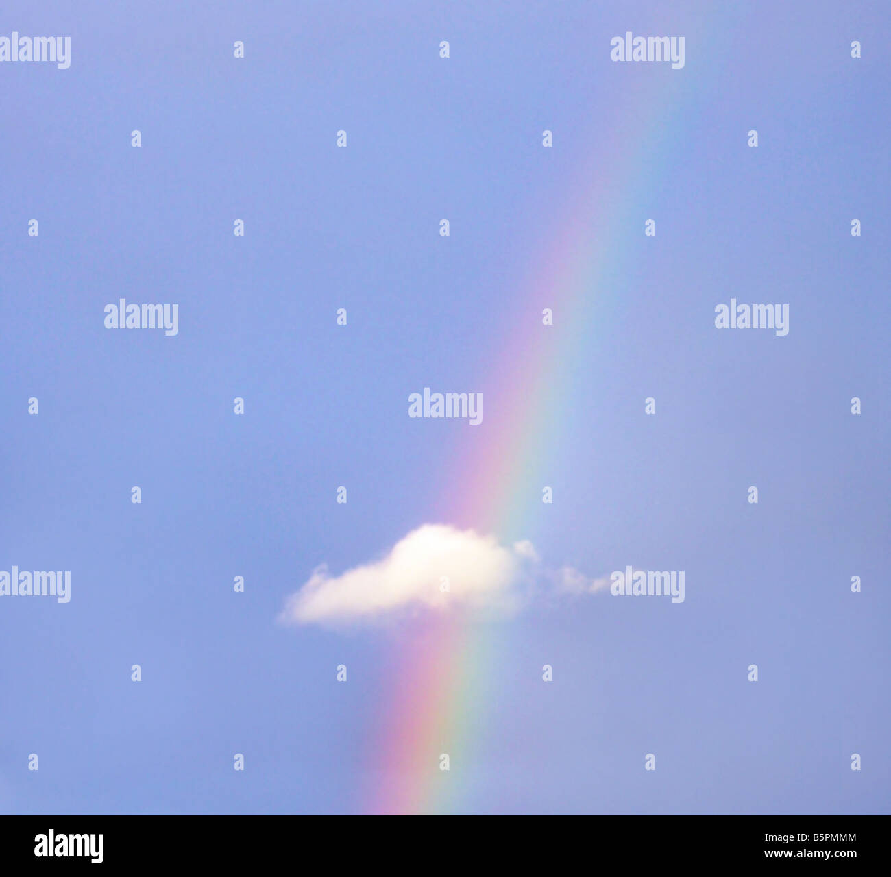 Rainbow with small cloud Stock Photo - Alamy