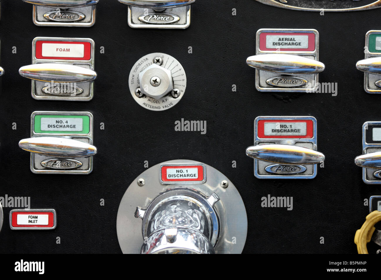 A control panel on the side of a fire truck that pumps water and foam ...