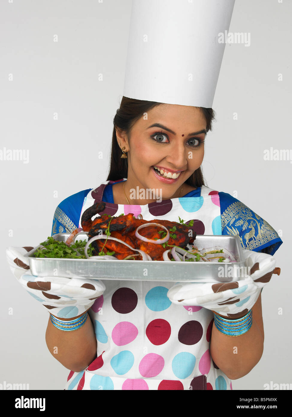 a happy asian lady chef with her roasted chicken Stock Photo - Alamy