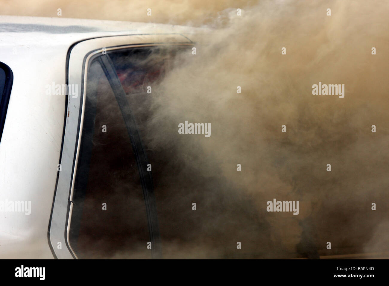 Smoke coming out of a car during a car fire Stock Photo - Alamy
