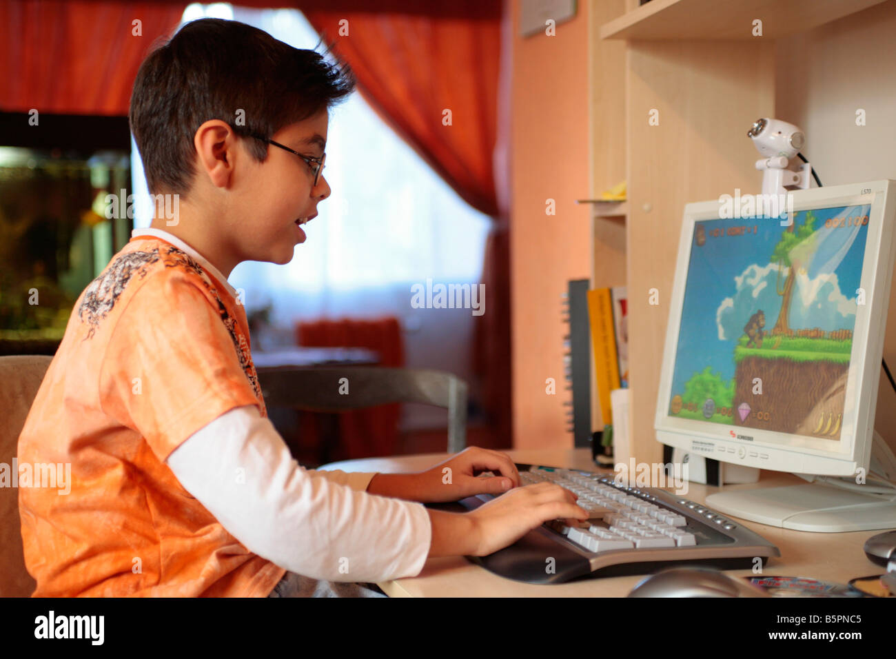 Black kids playing computer games hi-res stock photography and images ...