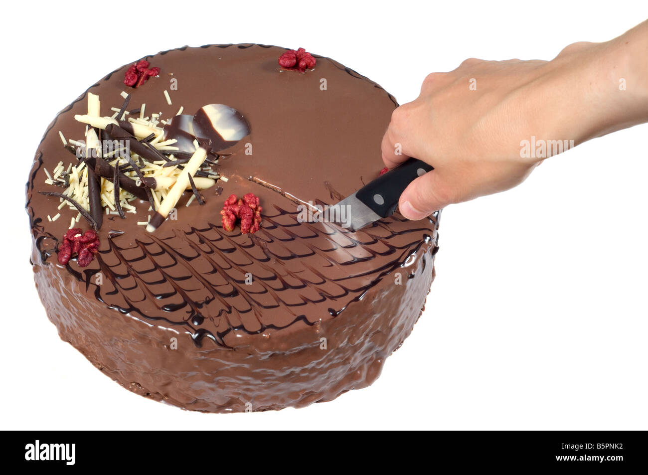Hand cutting a birthday cake with decoration cake Cut Out Stock Images ...