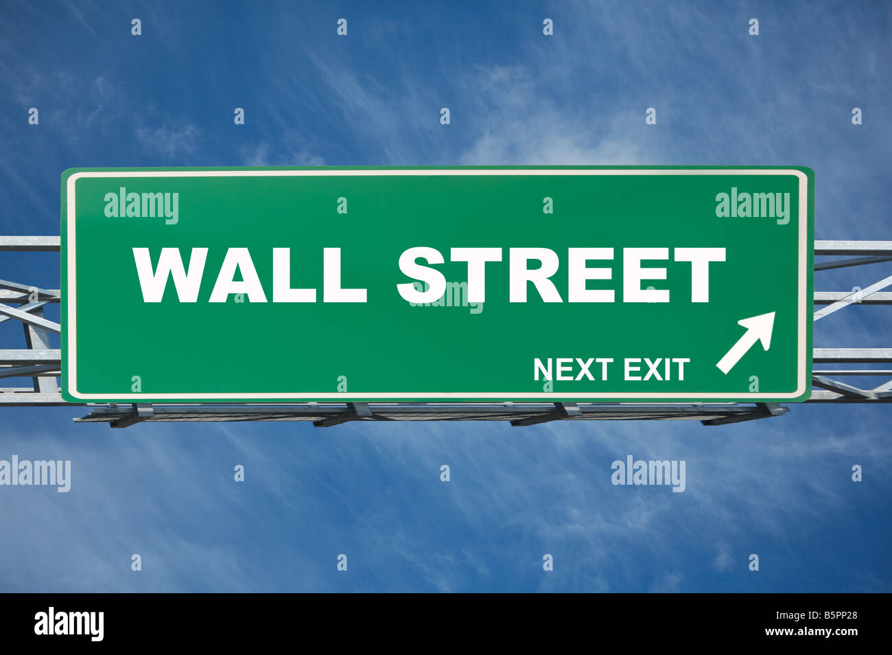 A large green traffic sign with wall street on it Stock Photo - Alamy