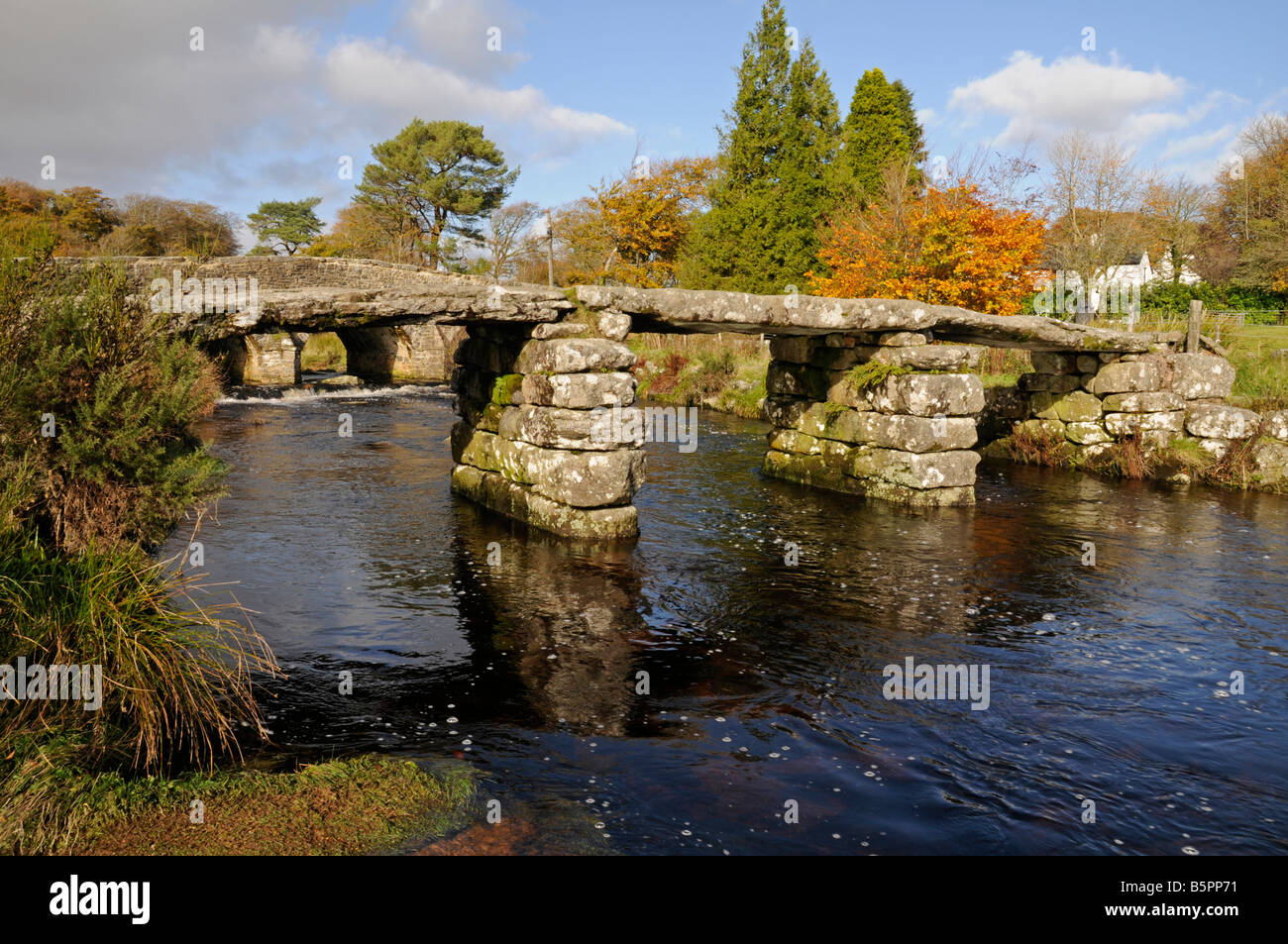 Ancient Clapper bridge across the East Dart River at Two Bridges ...