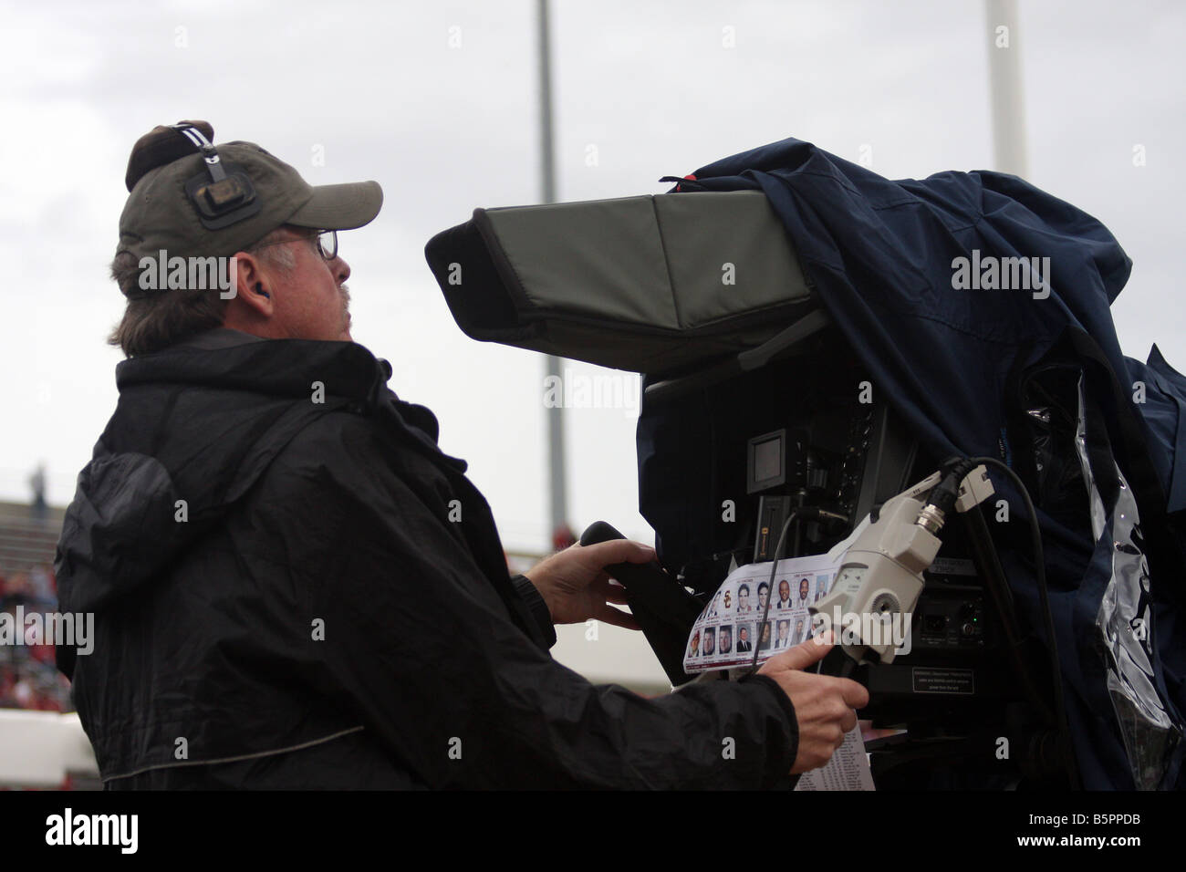 A television camera man films footage for the network televising a Pac ...