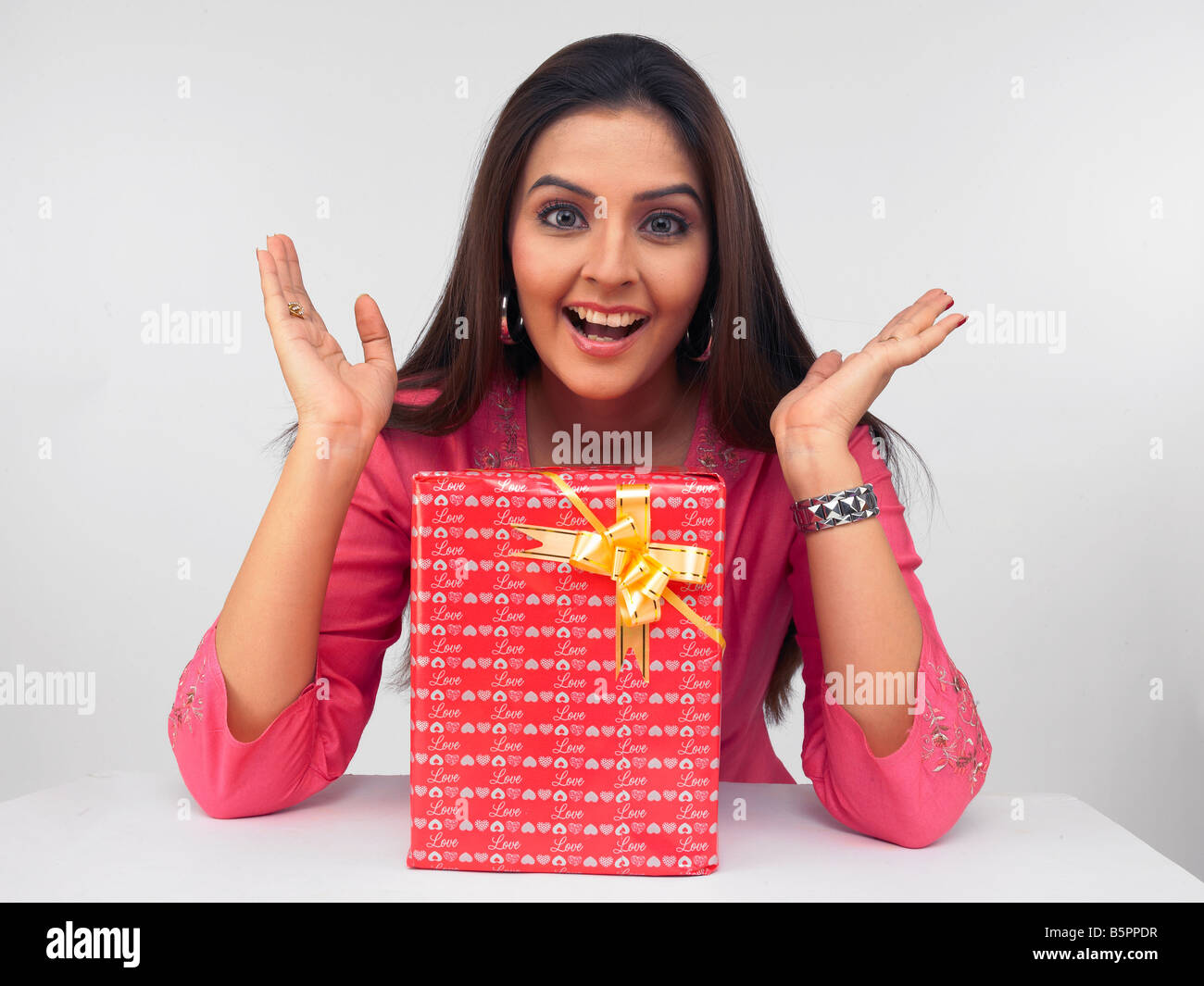 a pretty asian lady with a gift box Stock Photo - Alamy