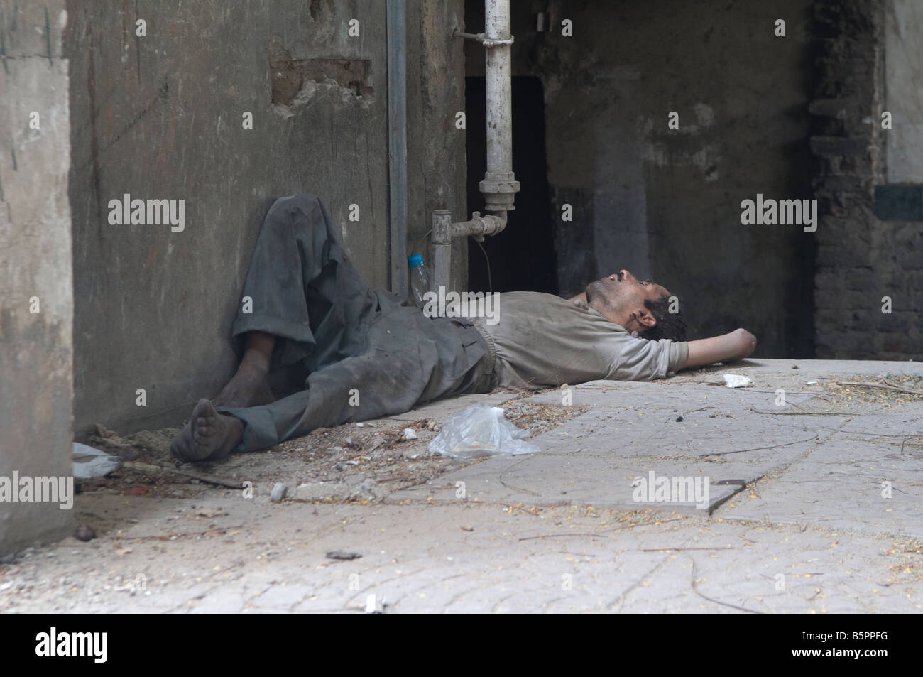 A homeless person sleeping outdoors in downtown Cairo Egypt Stock Photo ...
